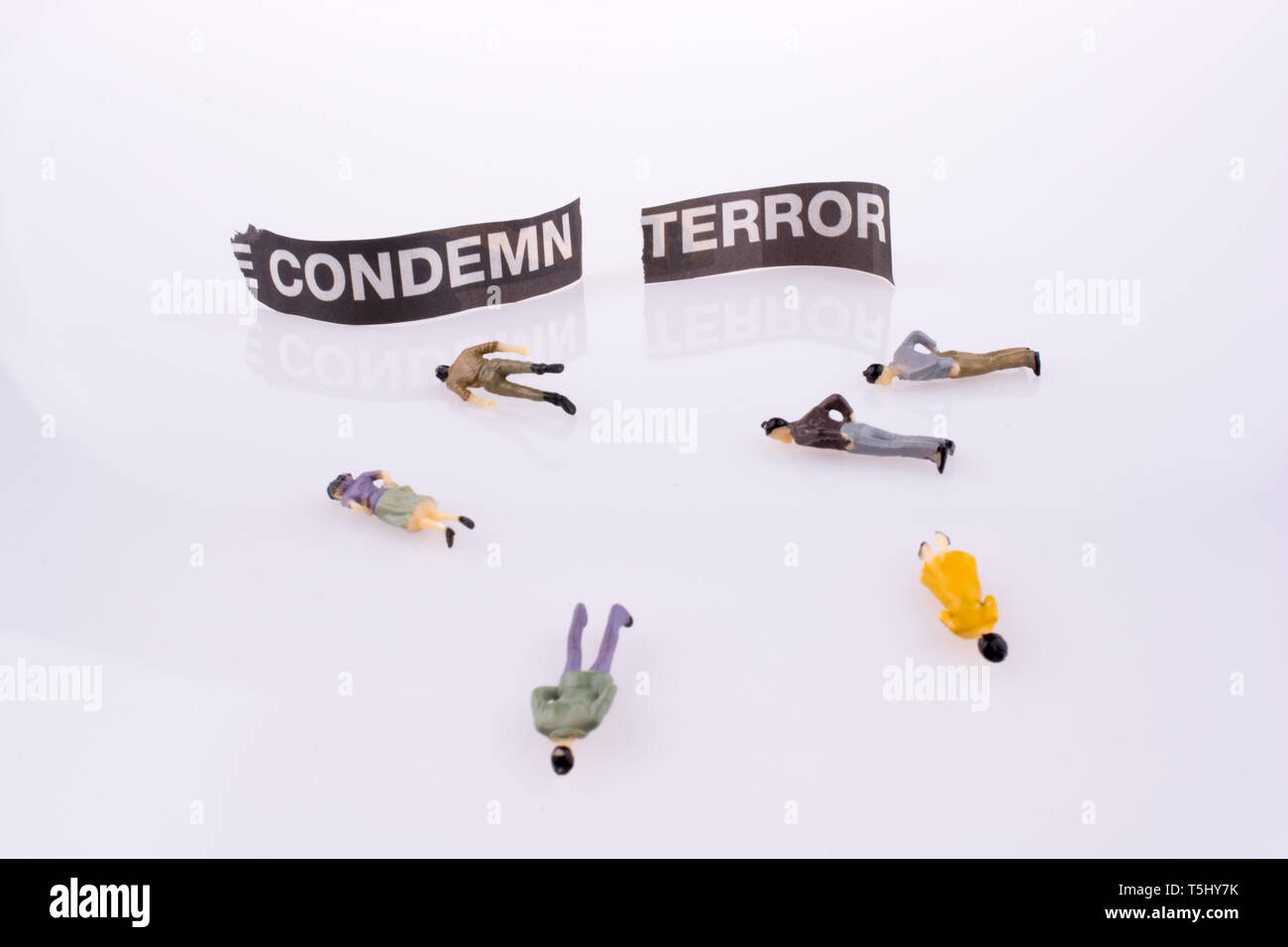 Human Figures near torn Newspaper Title Stock Photo - Alamy
