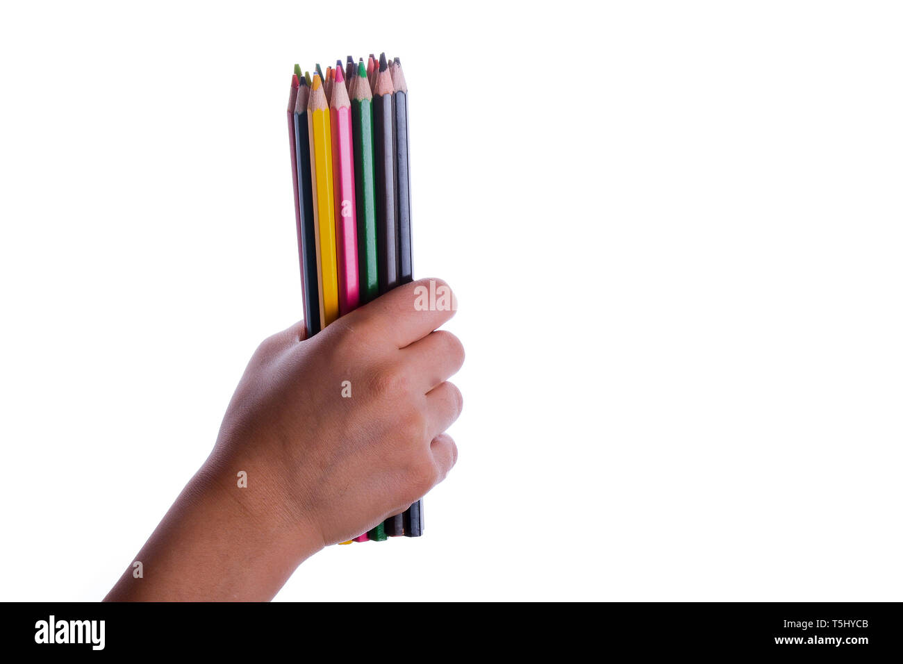 child holding colour pencils in hand on white background Stock Photo ...