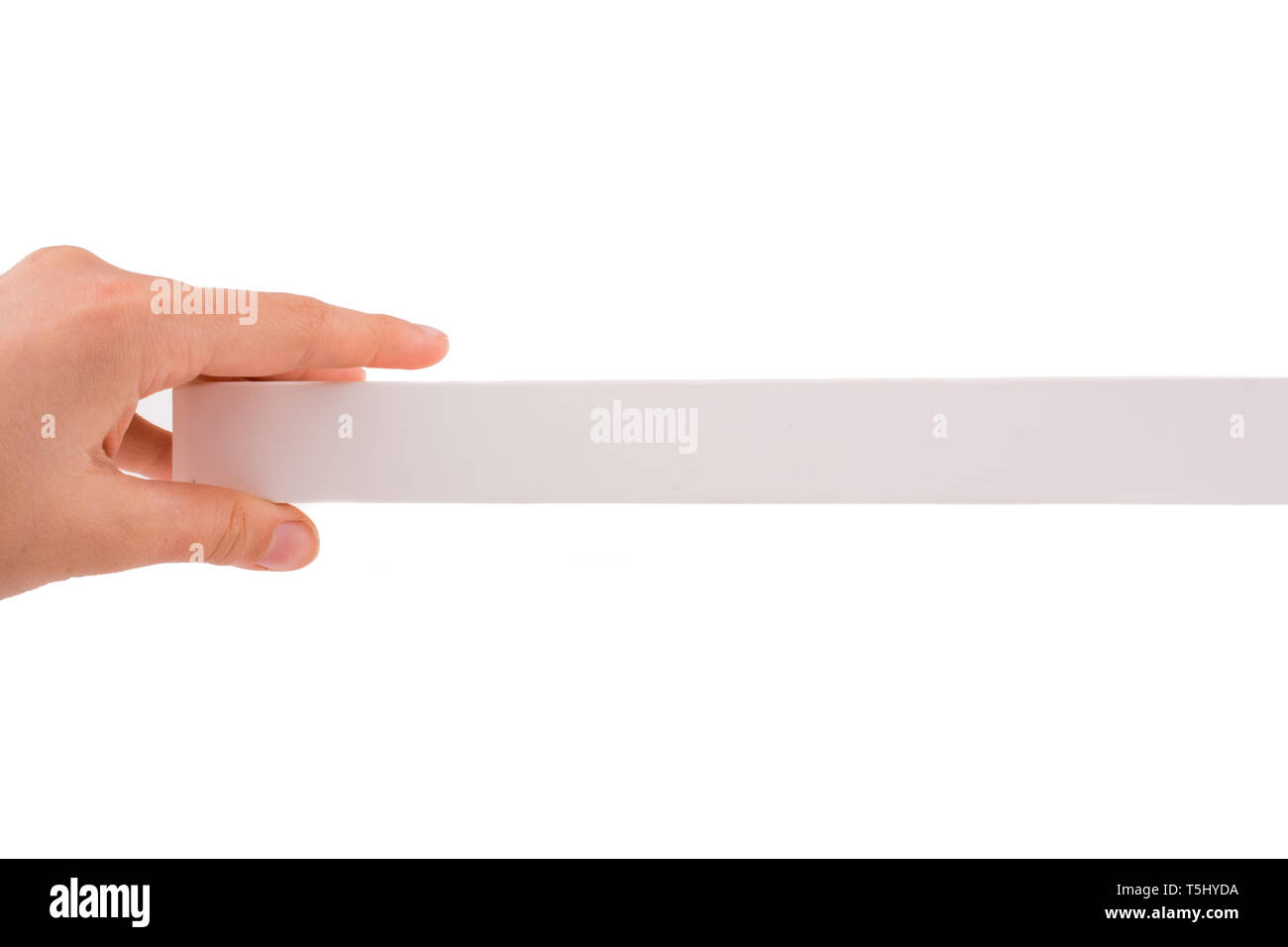 Hand holding a piece of paper on a white background Stock Photo - Alamy