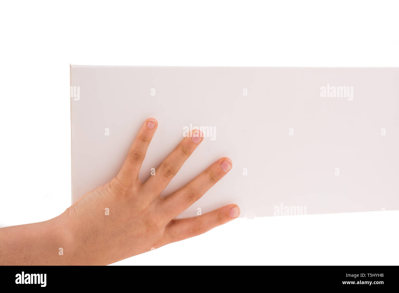 Hand holding a piece of paper on a white background Stock Photo - Alamy