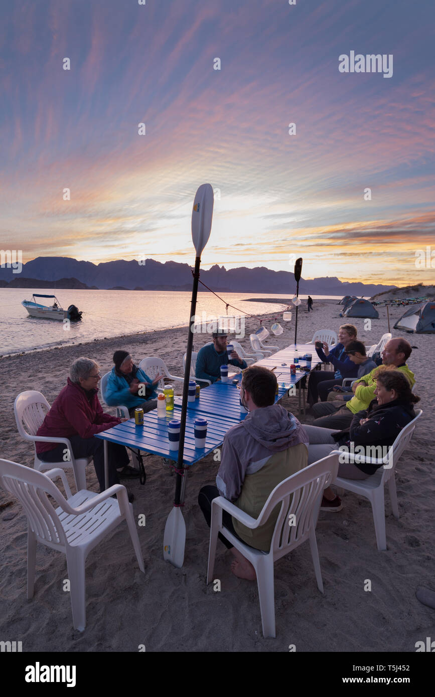 Sea kayak enjoying happy hour at sunset, Bay of Loreto Nat. Park, Baja ...