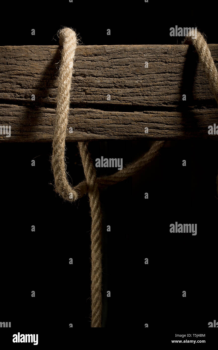 Rope on an old rotten wooden crossbeam Stock Photo - Alamy