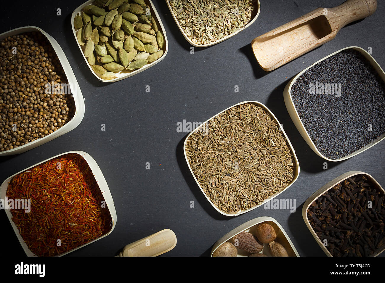 Spice Assortment on a Stone Chopping Board Stock Photo - Alamy