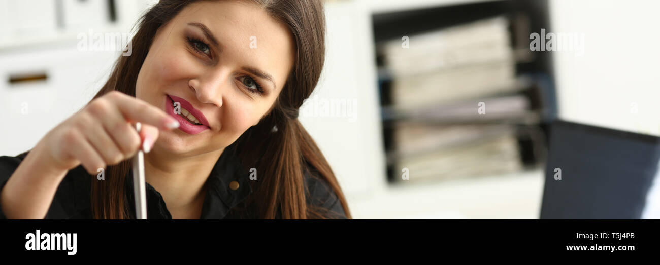 Beautiful smiling clerk girl at workplace talk to visitor Stock Photo ...