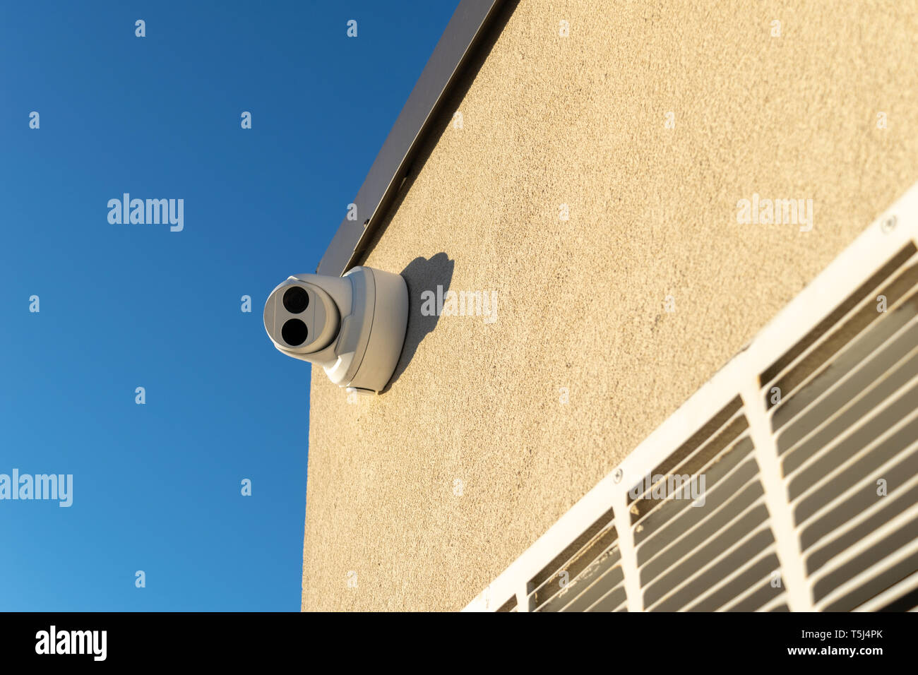 Security camera mounted on a wall, pointed straight at the viewer Stock ...
