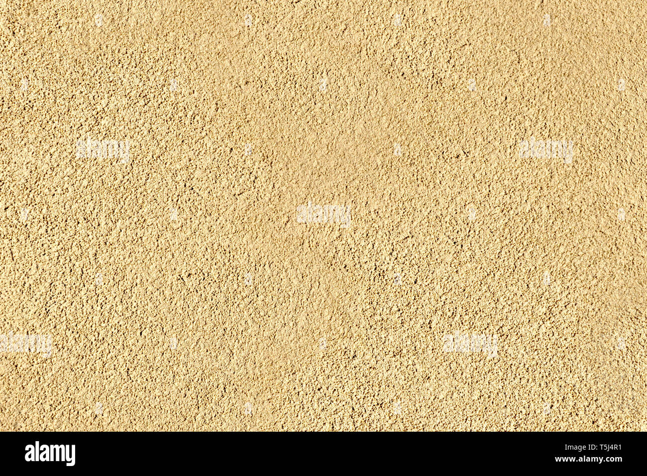Grainy yellow concrete wall texture Stock Photo - Alamy