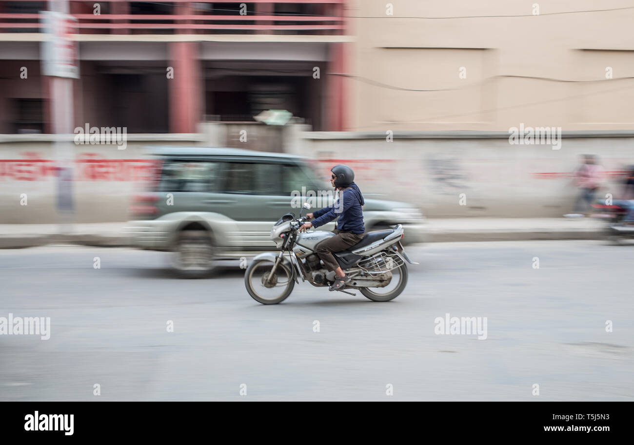 Motorcycle speeding through traffic Stock Photo - Alamy