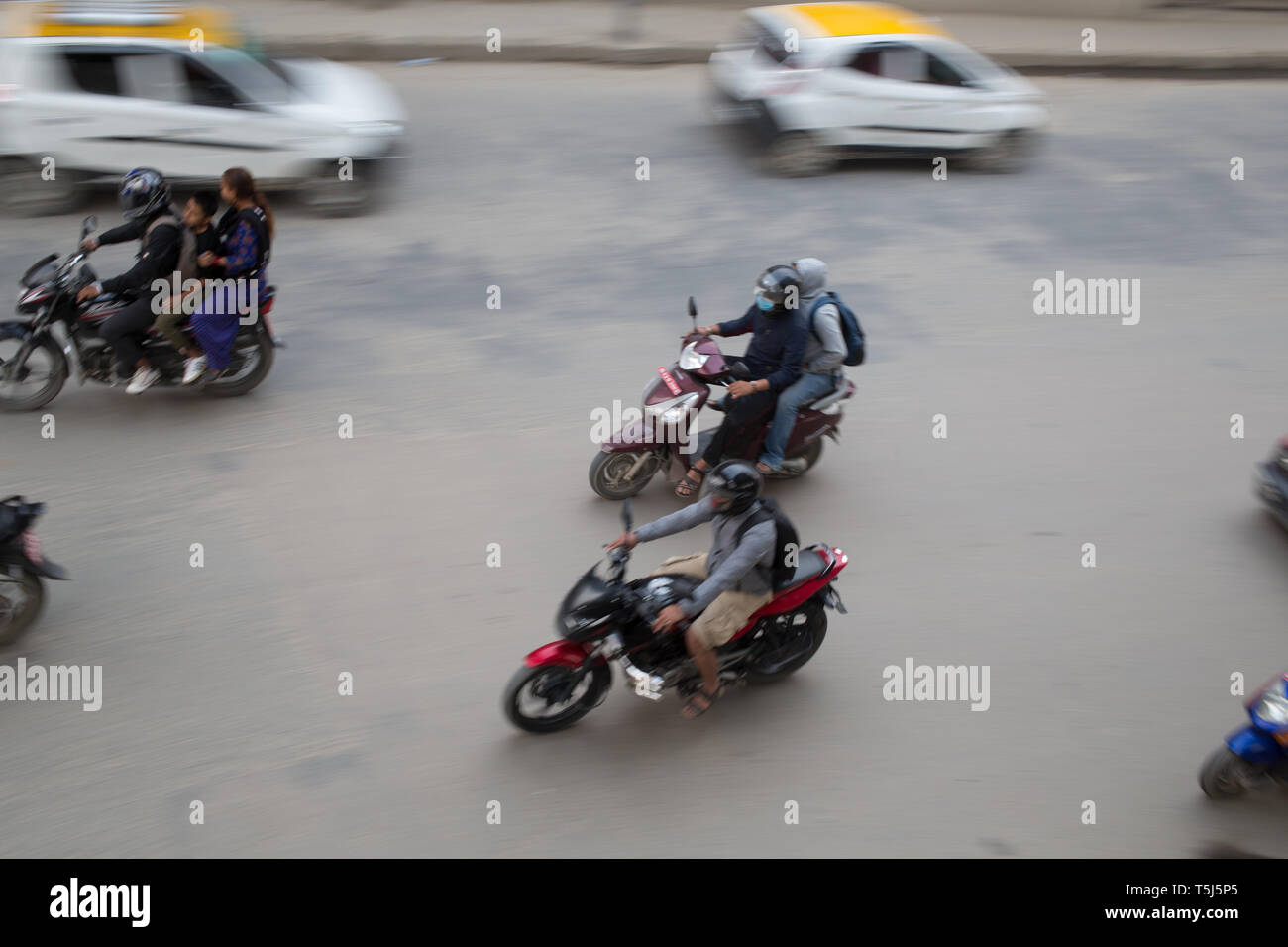 Motorcycles speeding through traffic Stock Photo - Alamy