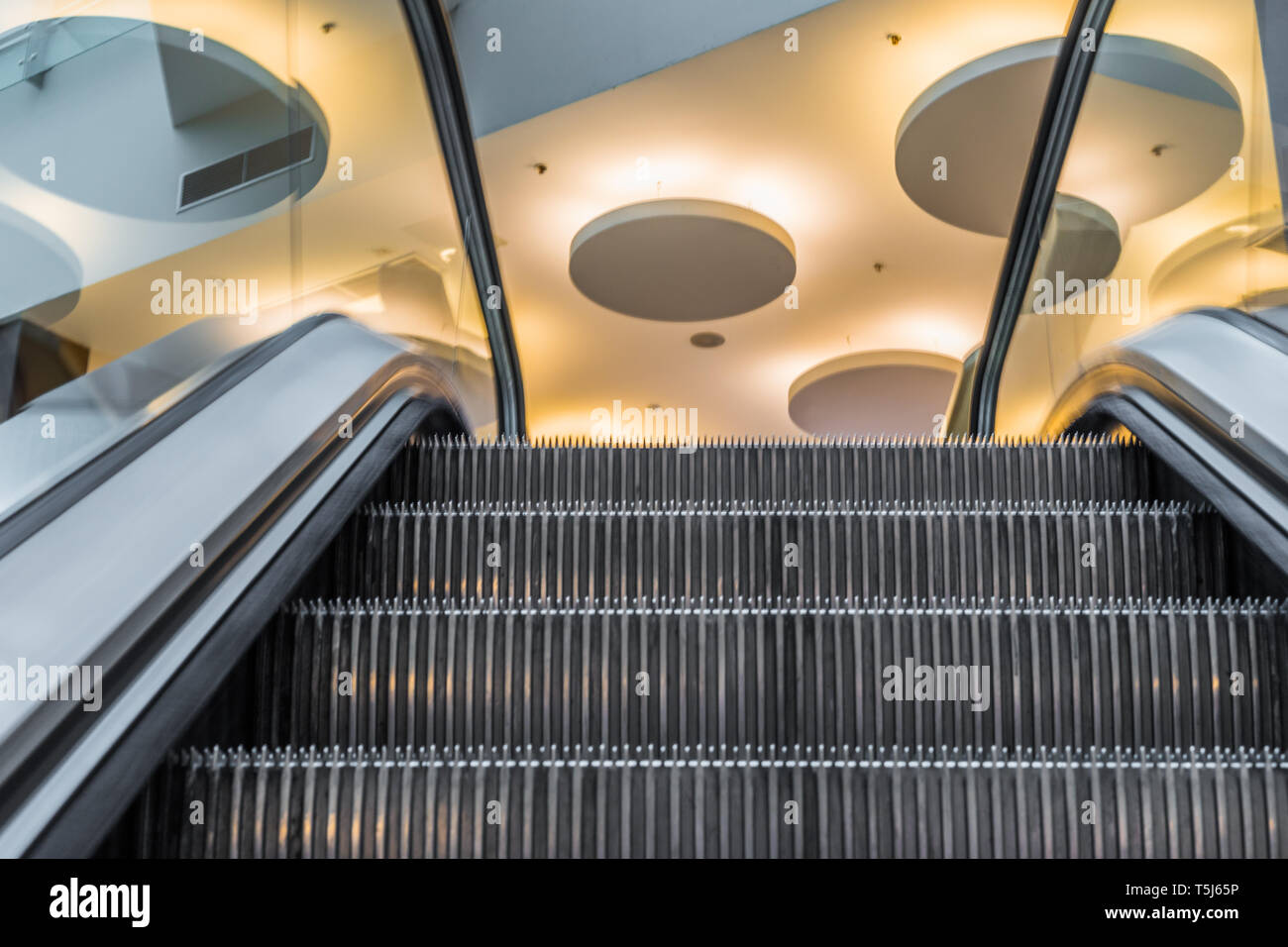 Close-up of an escalator steps in a shopping center Stock Photo - Alamy