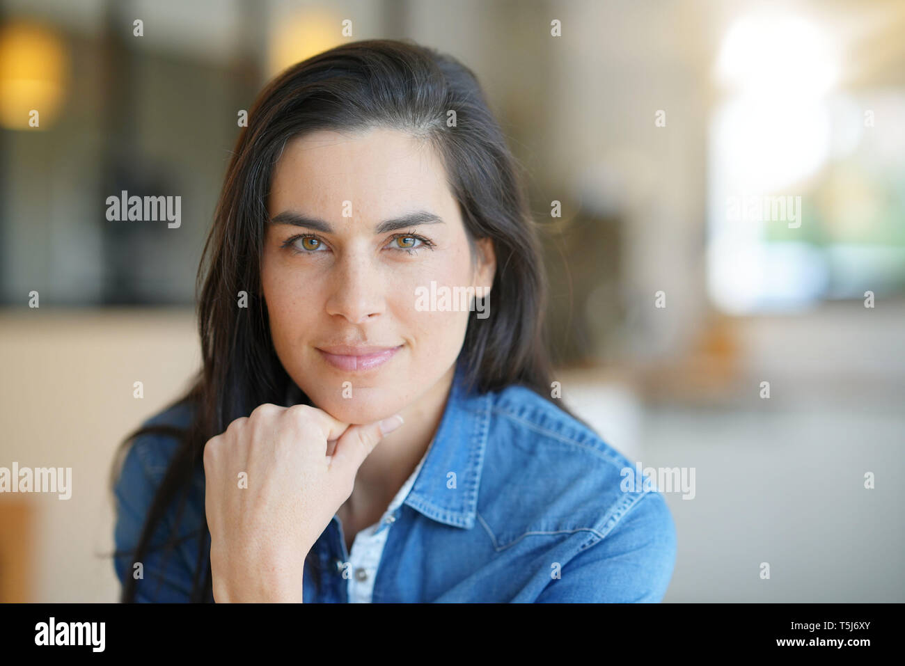 Portrait of middle-aged woman looking at camera Stock Photo - Alamy