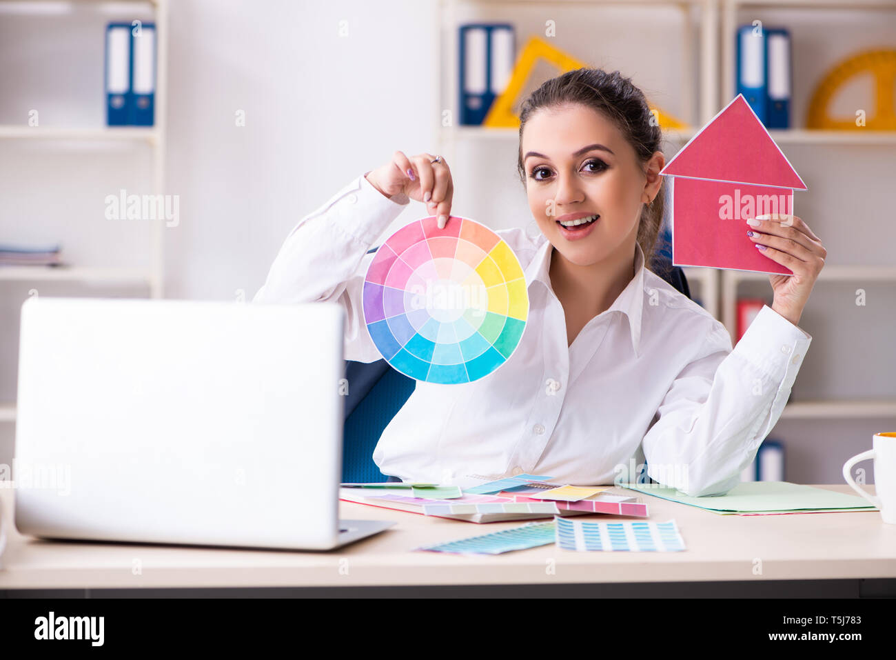 Female beautiful designer working in the office Stock Photo - Alamy