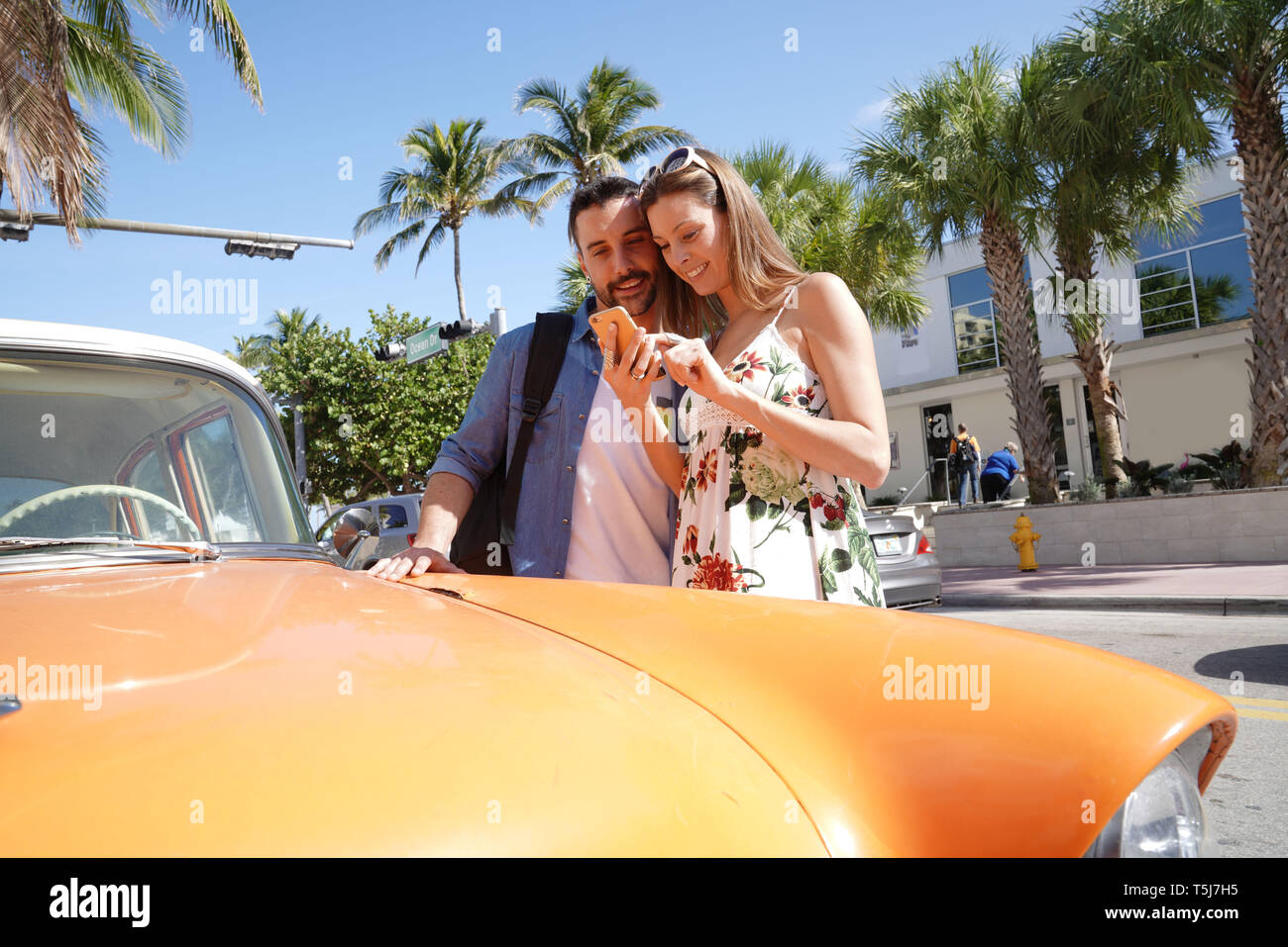 Couple of tourists in Miami taking selfie pictures Stock Photo - Alamy