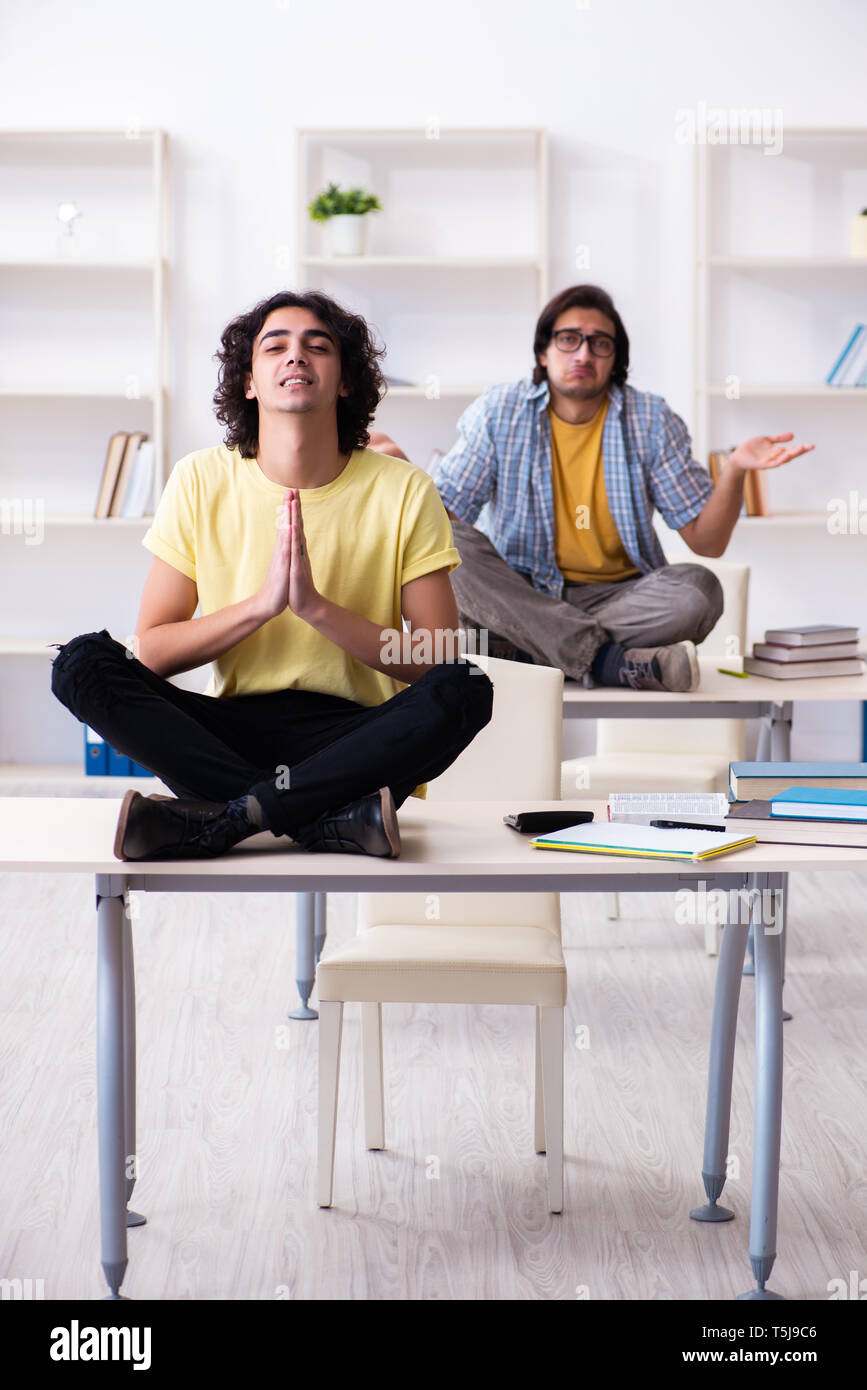 Two male students in the classroom Stock Photo - Alamy