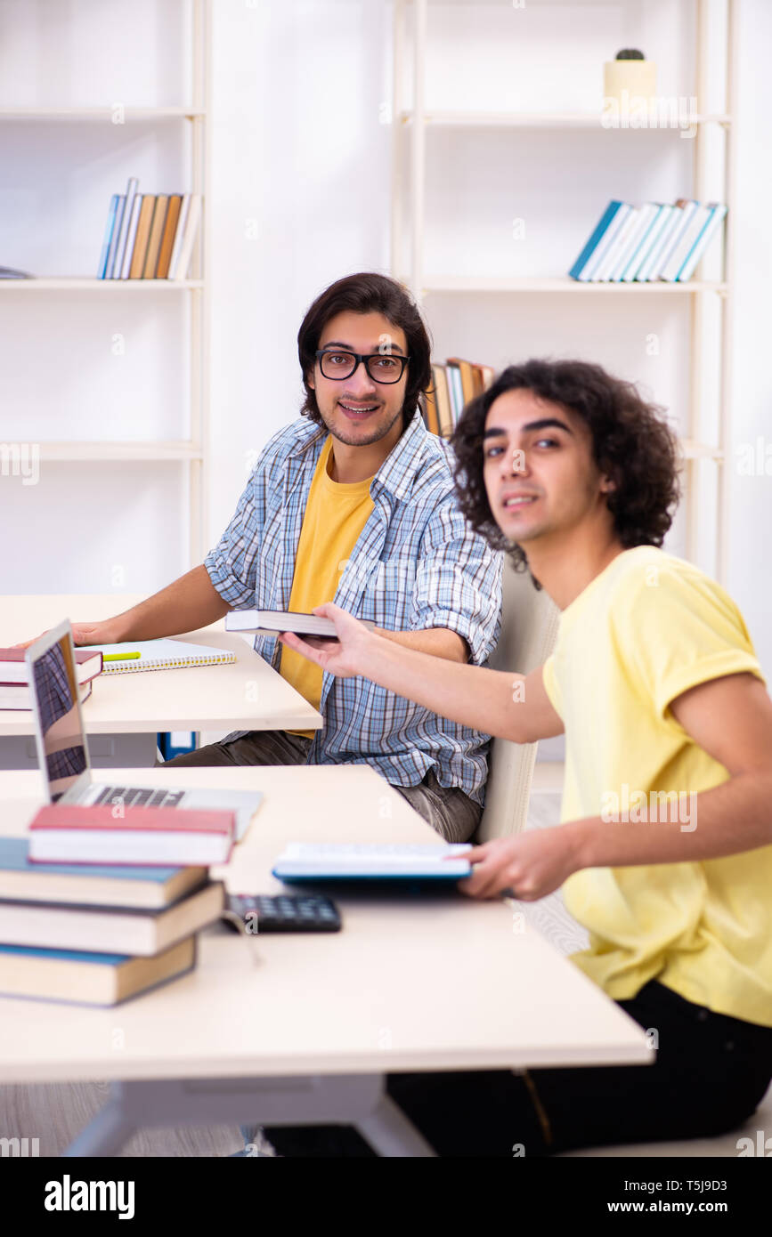Two male students in the classroom Stock Photo - Alamy