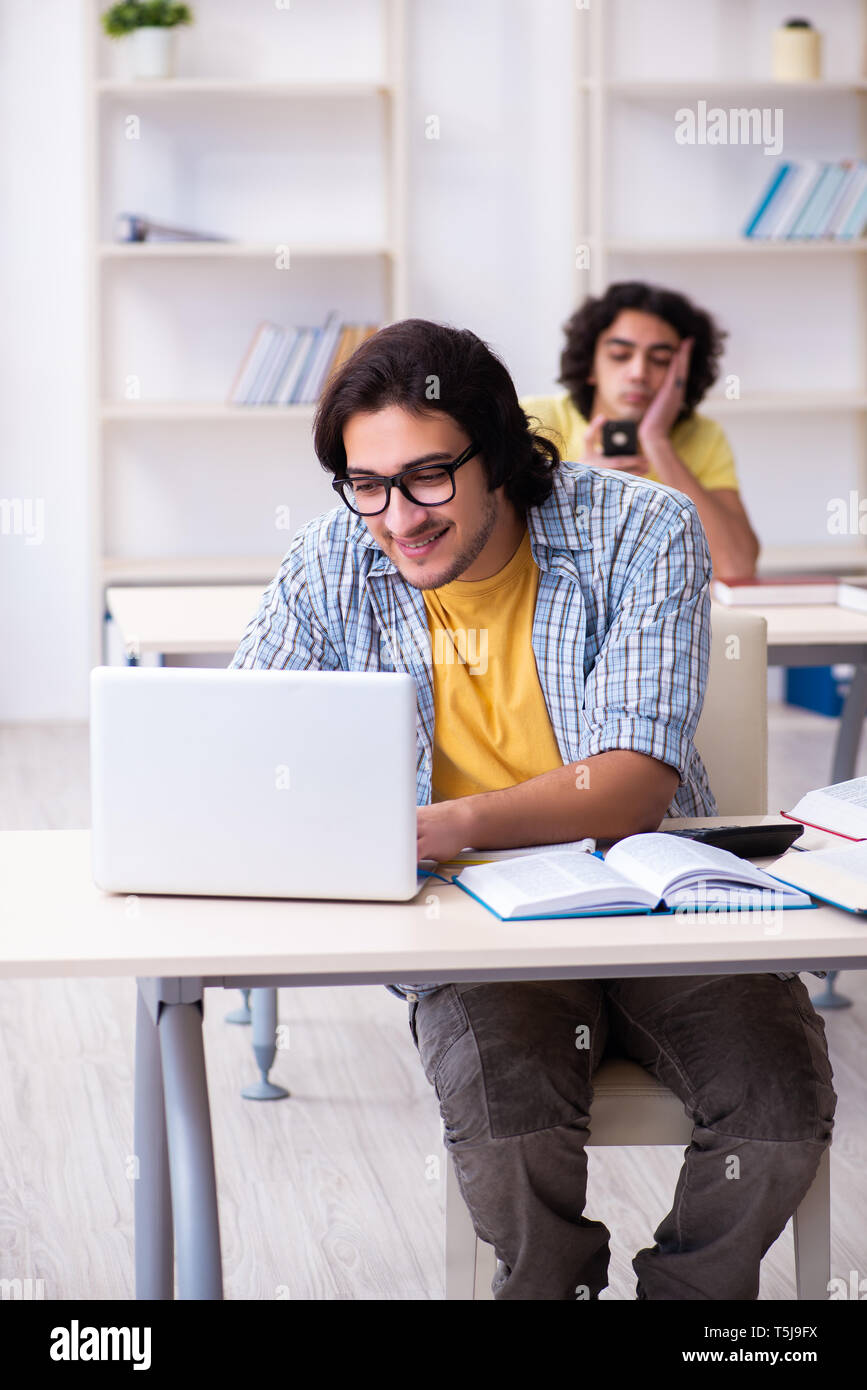 Two male students in the classroom Stock Photo - Alamy