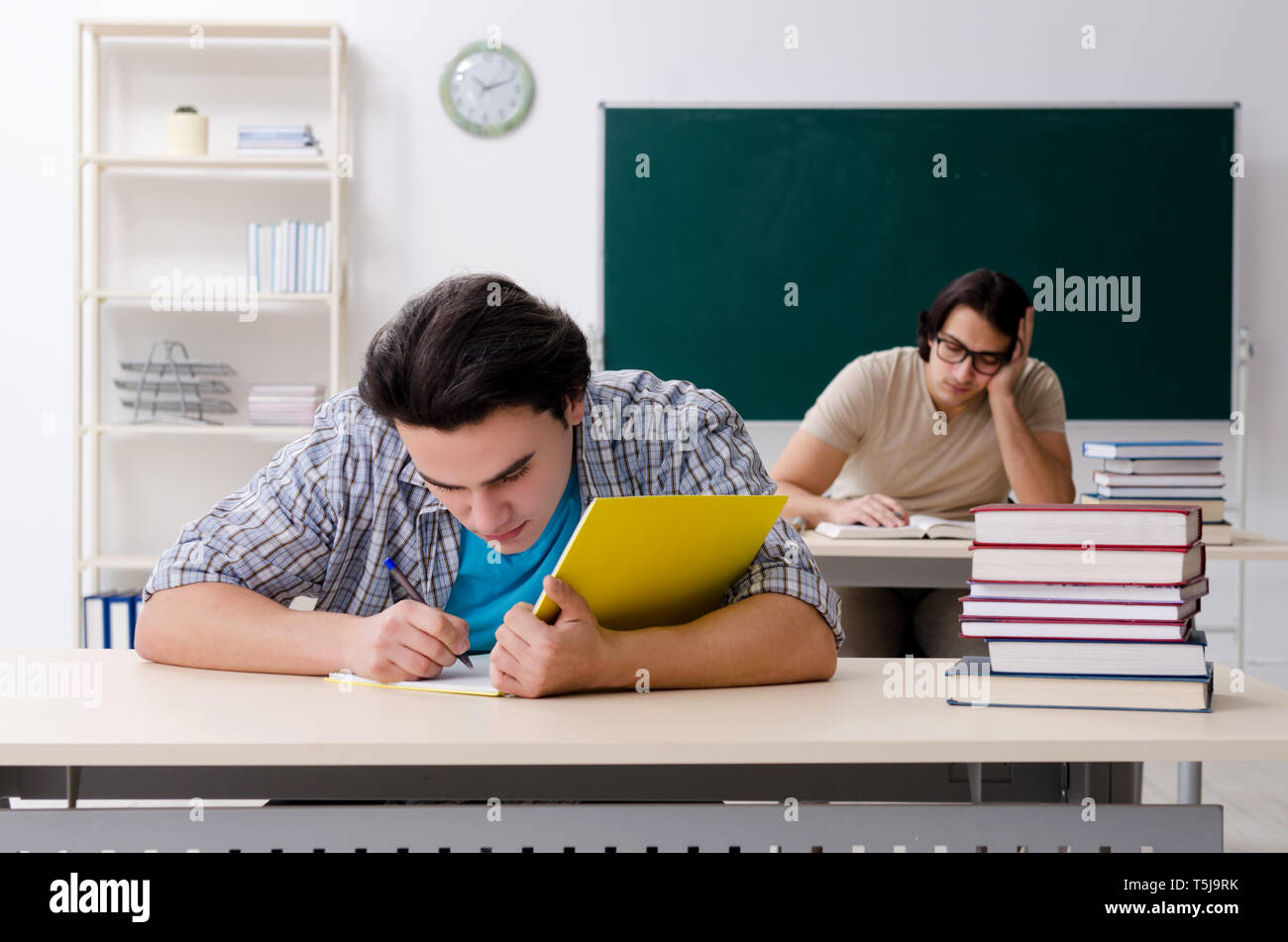Two male students in the classroom Stock Photo - Alamy
