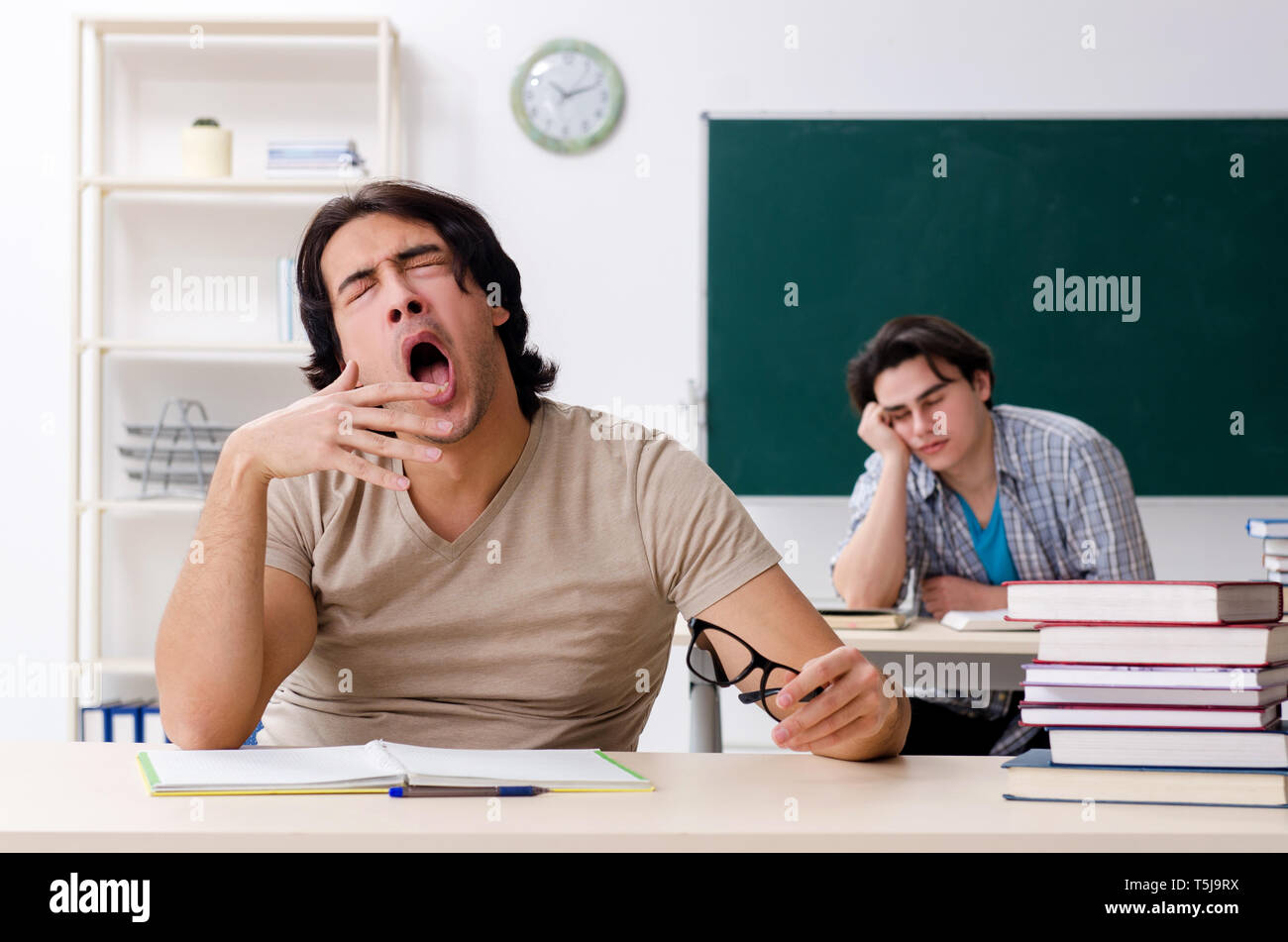 Two male students in the classroom Stock Photo - Alamy