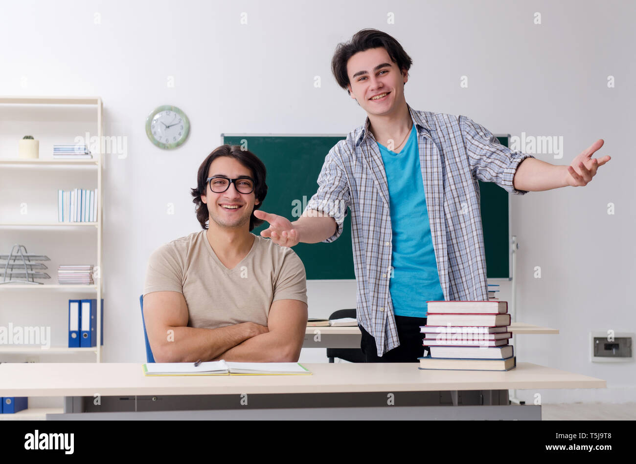 Two male students in the classroom Stock Photo - Alamy