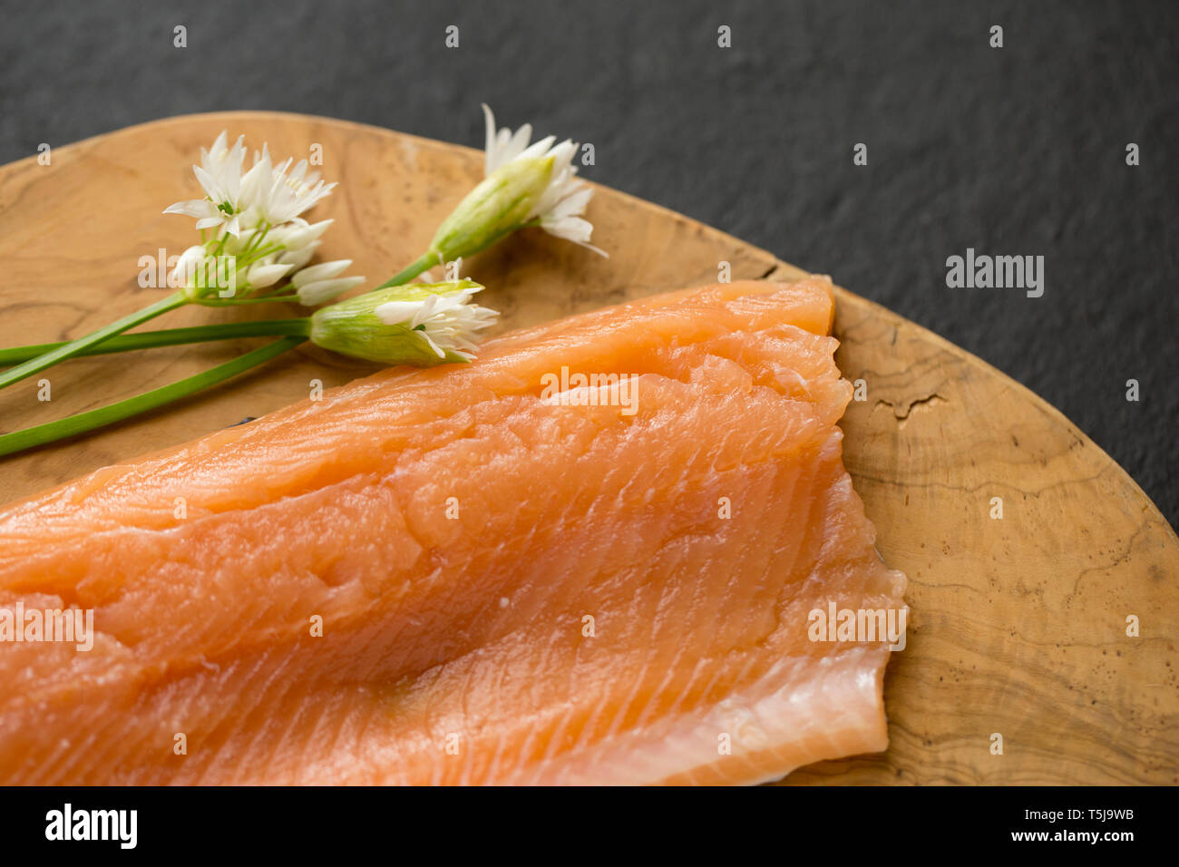 A single, raw fillet from a rainbow trout, Oncorhynchus mykiss, that ...