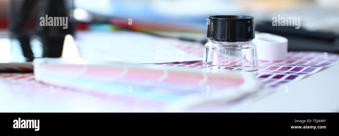 Test print paper page with colour test design fantail and magnifying ...