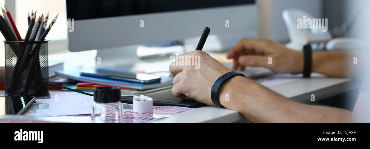 Designer male arm hold graphic pad pen working on project Stock Photo ...