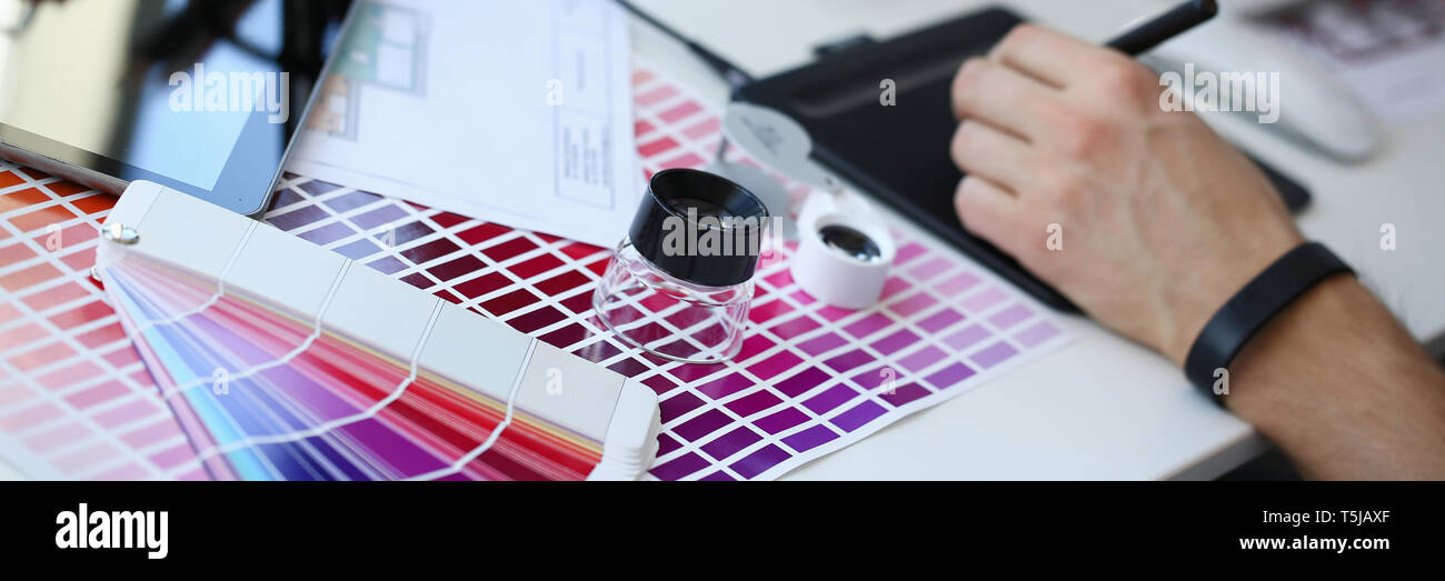 Test print paper page with colour test design fantail and magnifying ...