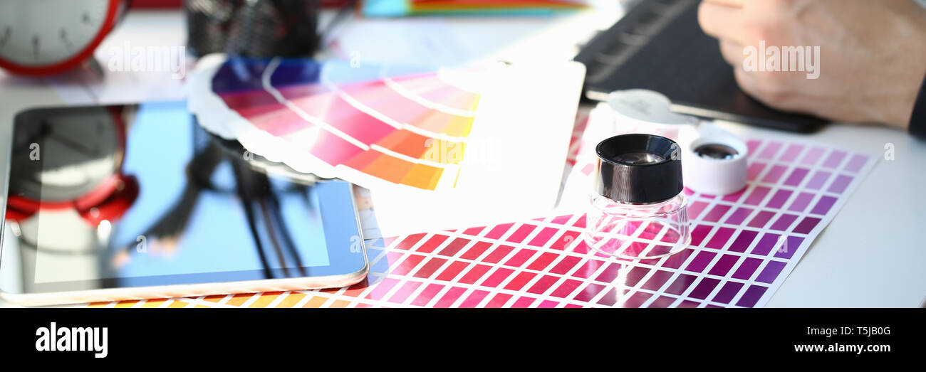 Test print paper page with colour test design fantail and magnifying ...