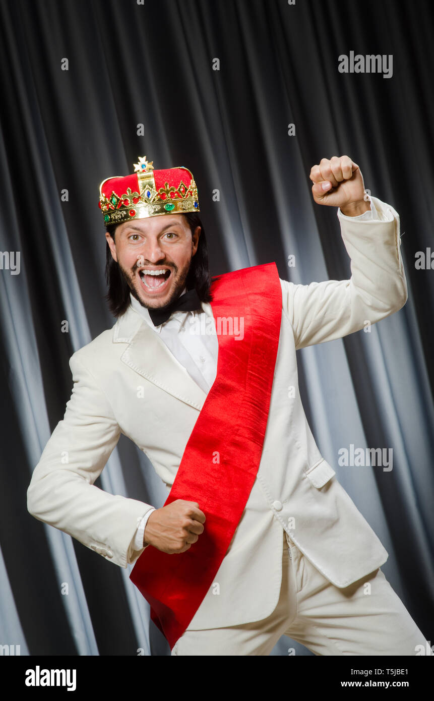 Funny king wearing crown in coronation concept Stock Photo - Alamy