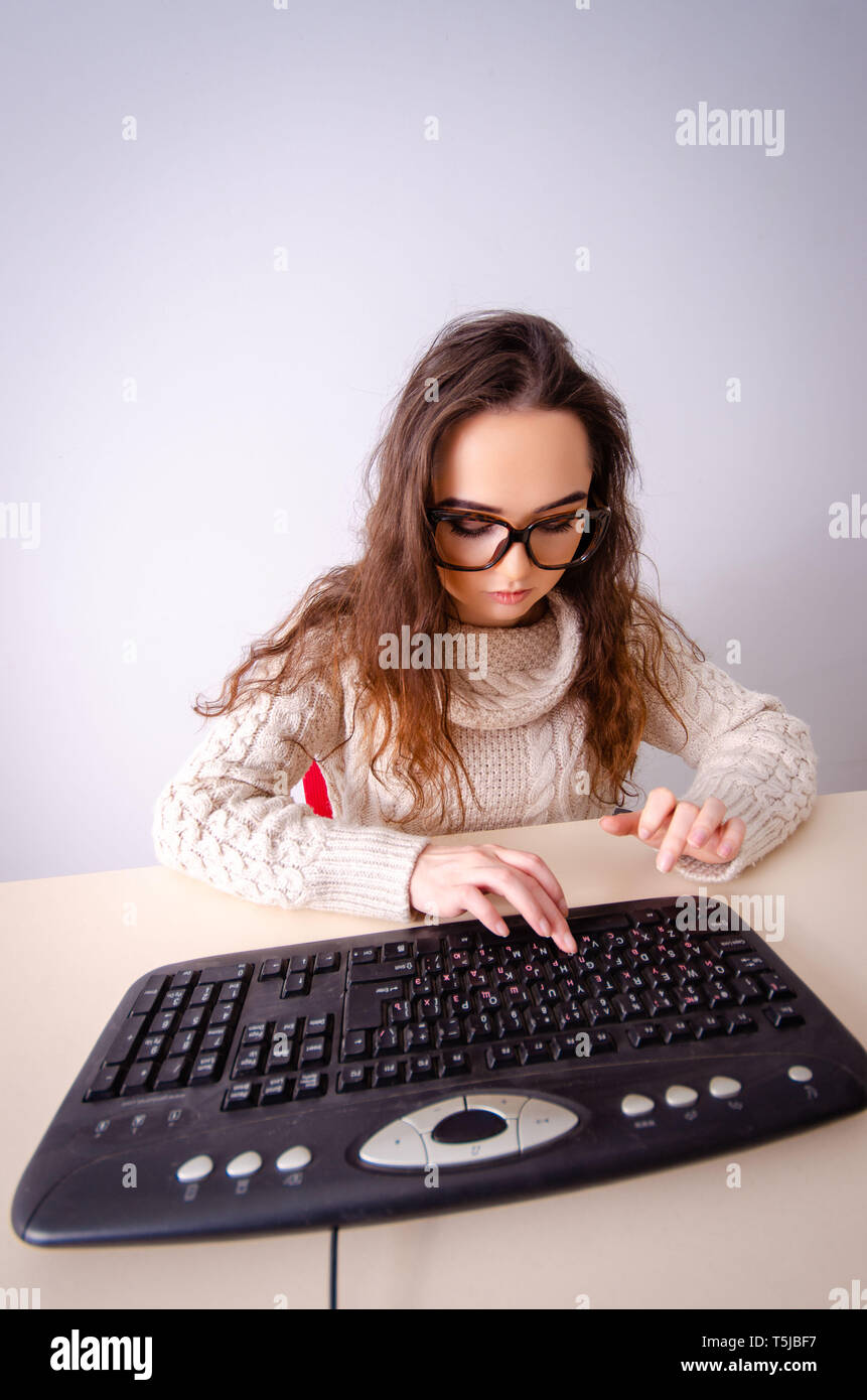 Funny nerd girl working on computer Stock Photo - Alamy