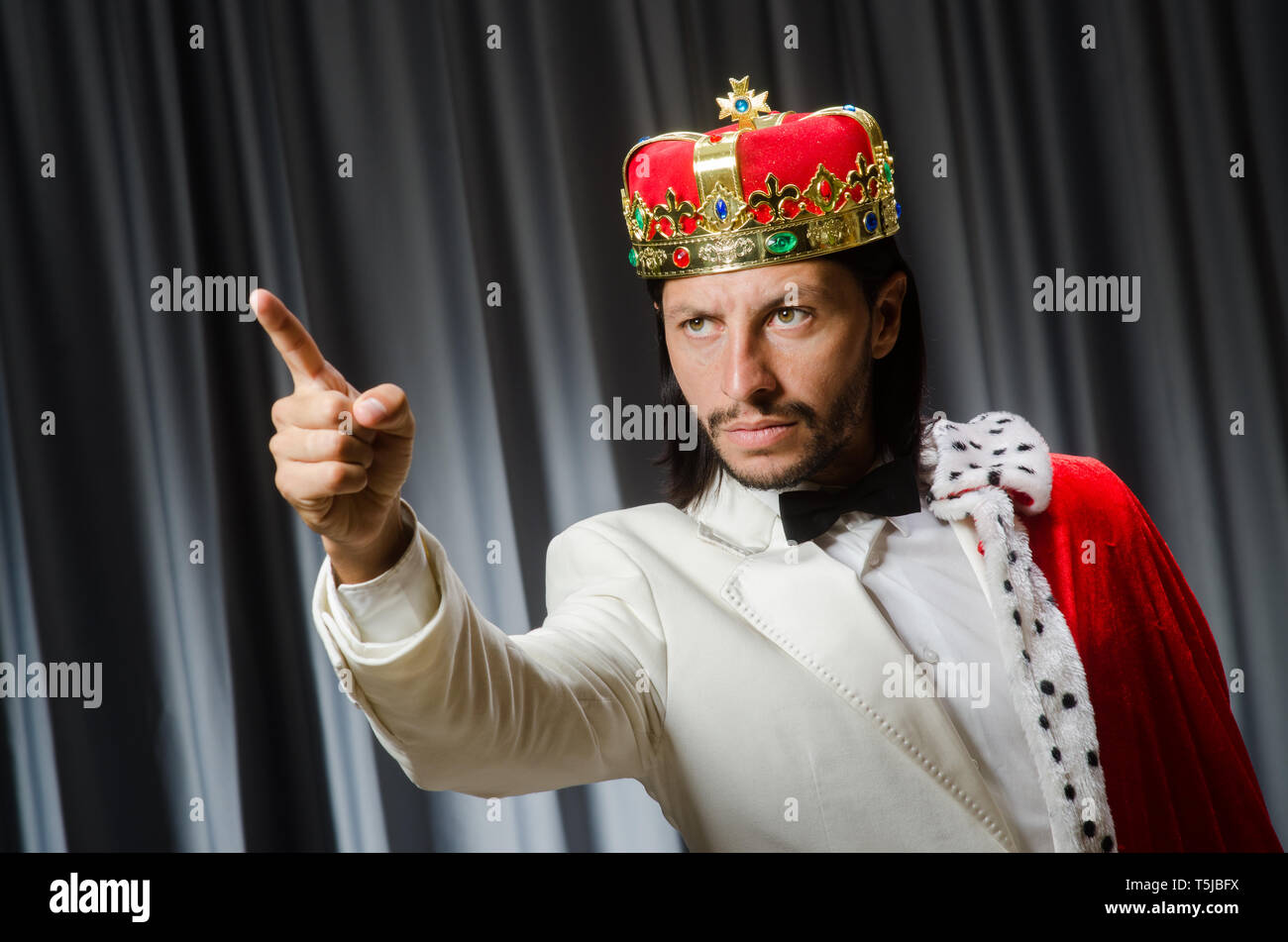 Funny king wearing crown in coronation concept Stock Photo - Alamy