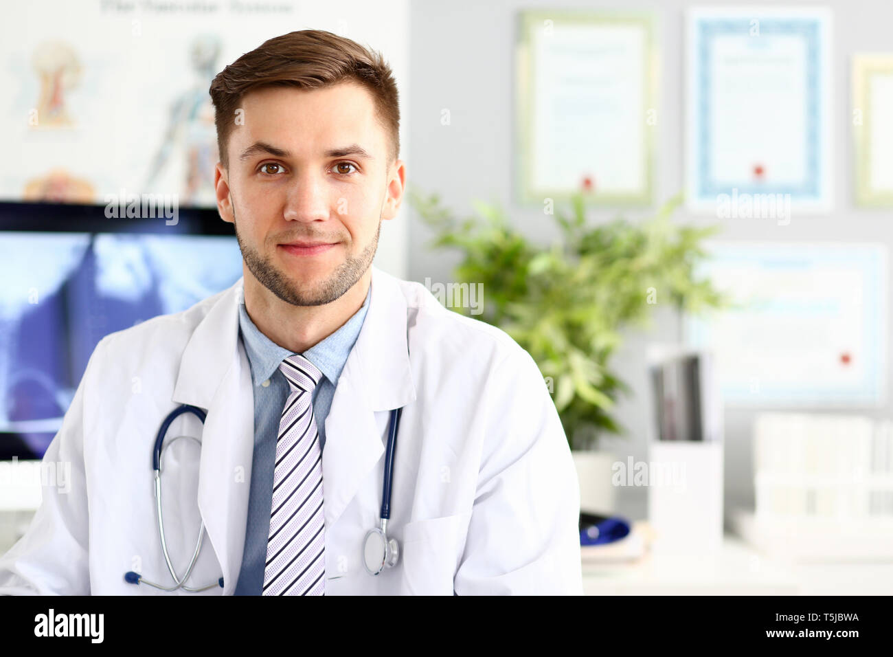Doctor sitting in office hi-res stock photography and images - Alamy