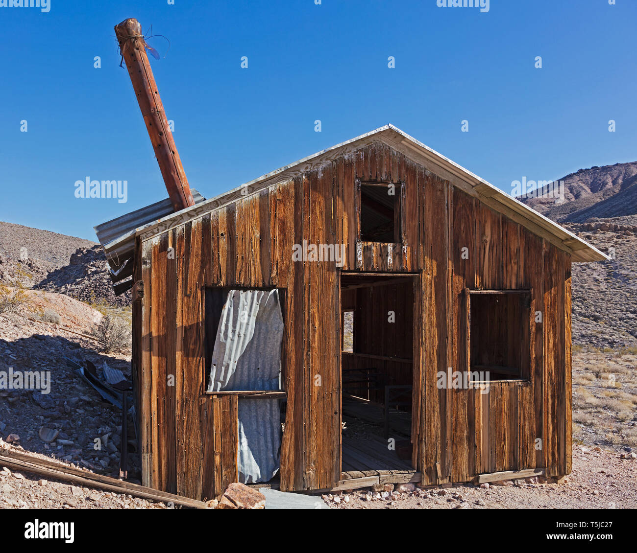 Tall stove pipe with screen spark arrestor shows concern over fire at ...