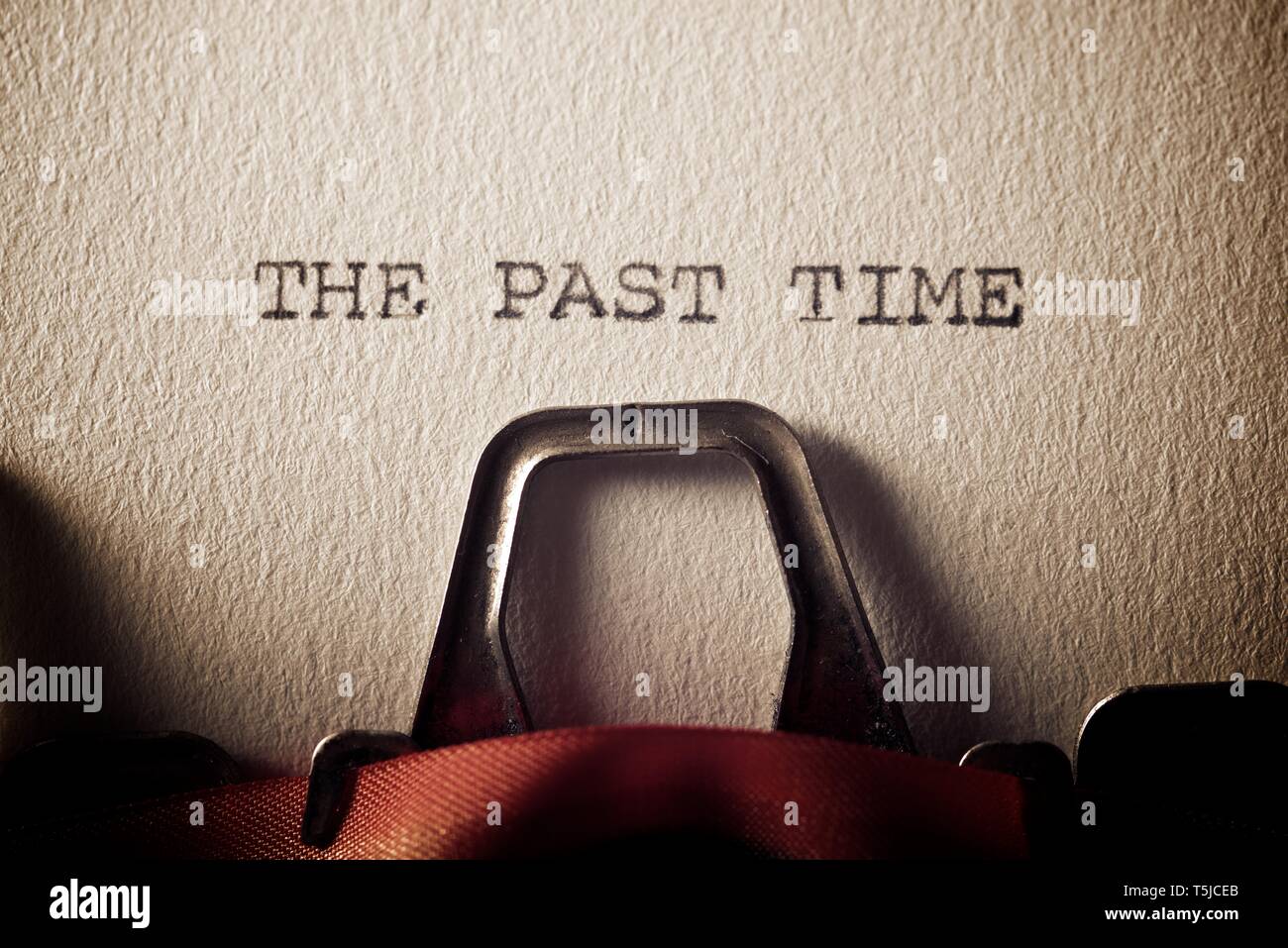 The sentence, the past time, written with a typewriter Stock Photo - Alamy
