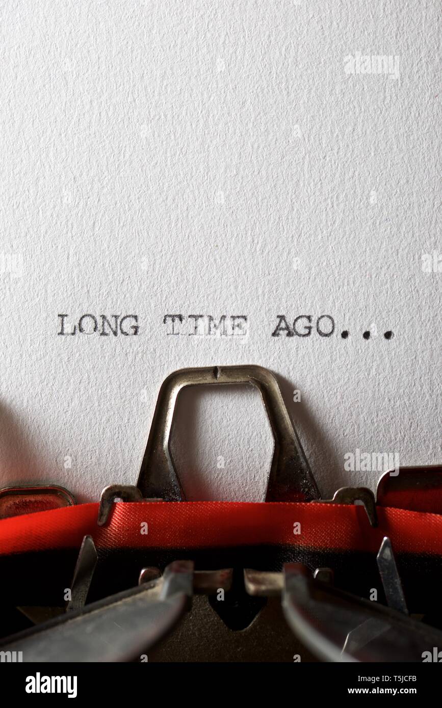 The sentence, long time ago, written with a typewriter Stock Photo - Alamy