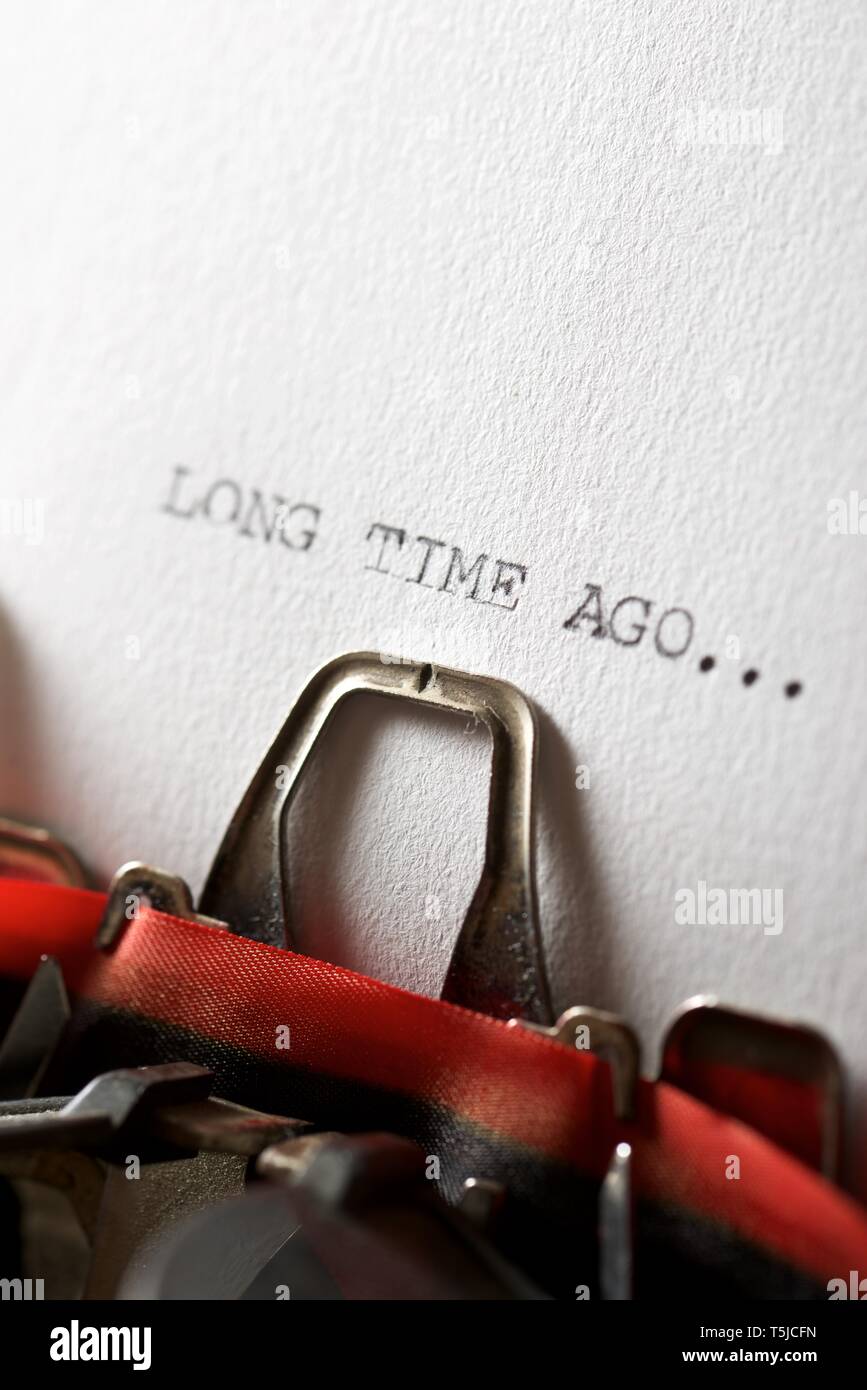 The sentence, long time ago, written with a typewriter Stock Photo - Alamy
