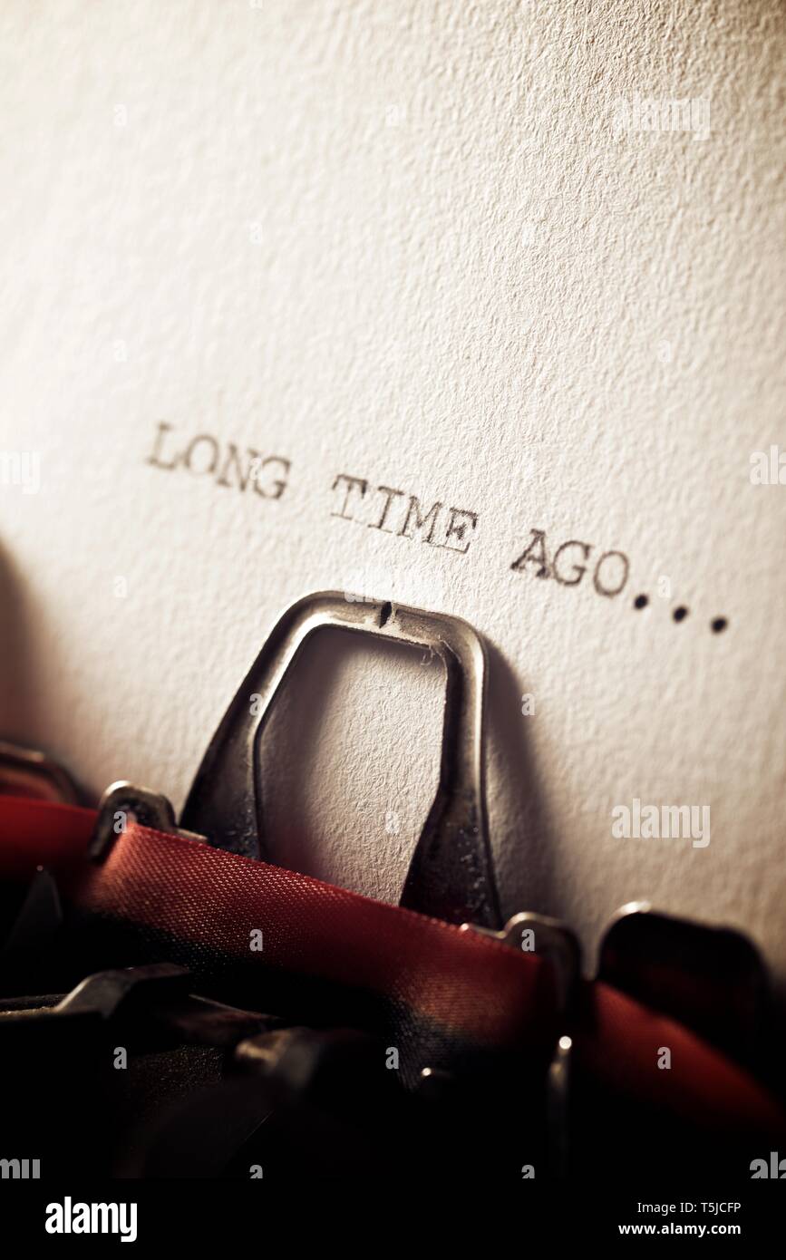 The sentence, long time ago, written with a typewriter Stock Photo - Alamy