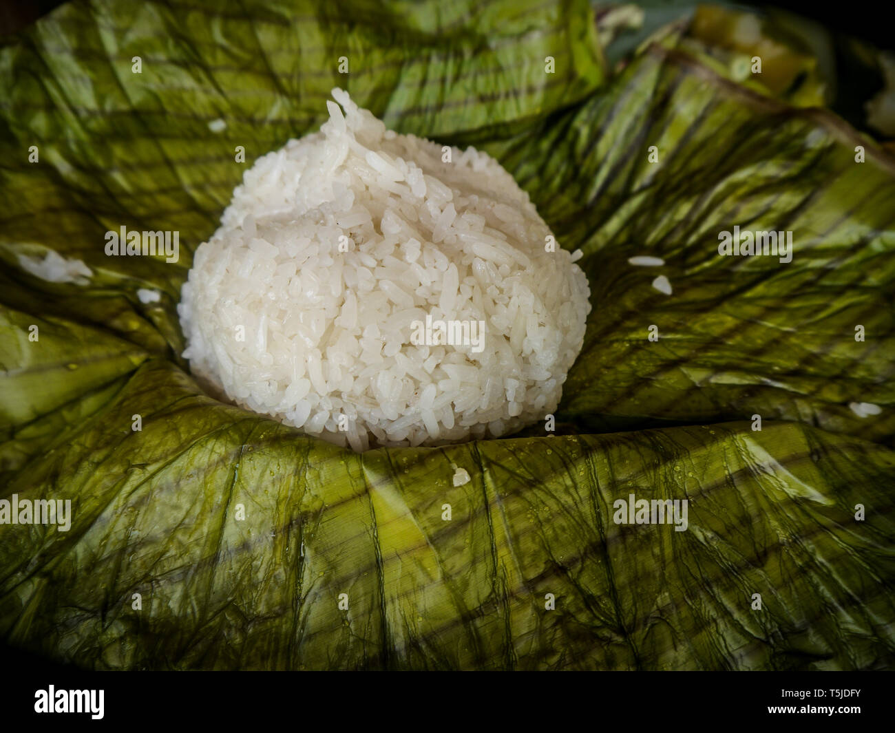 Banana leaf wrapped in rice Stock Photo - Alamy