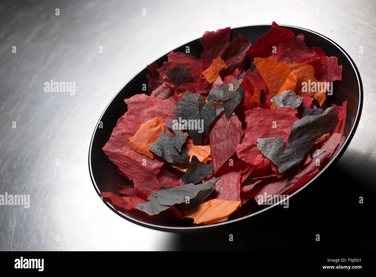 Colored chips in a bowl Stock Photo - Alamy