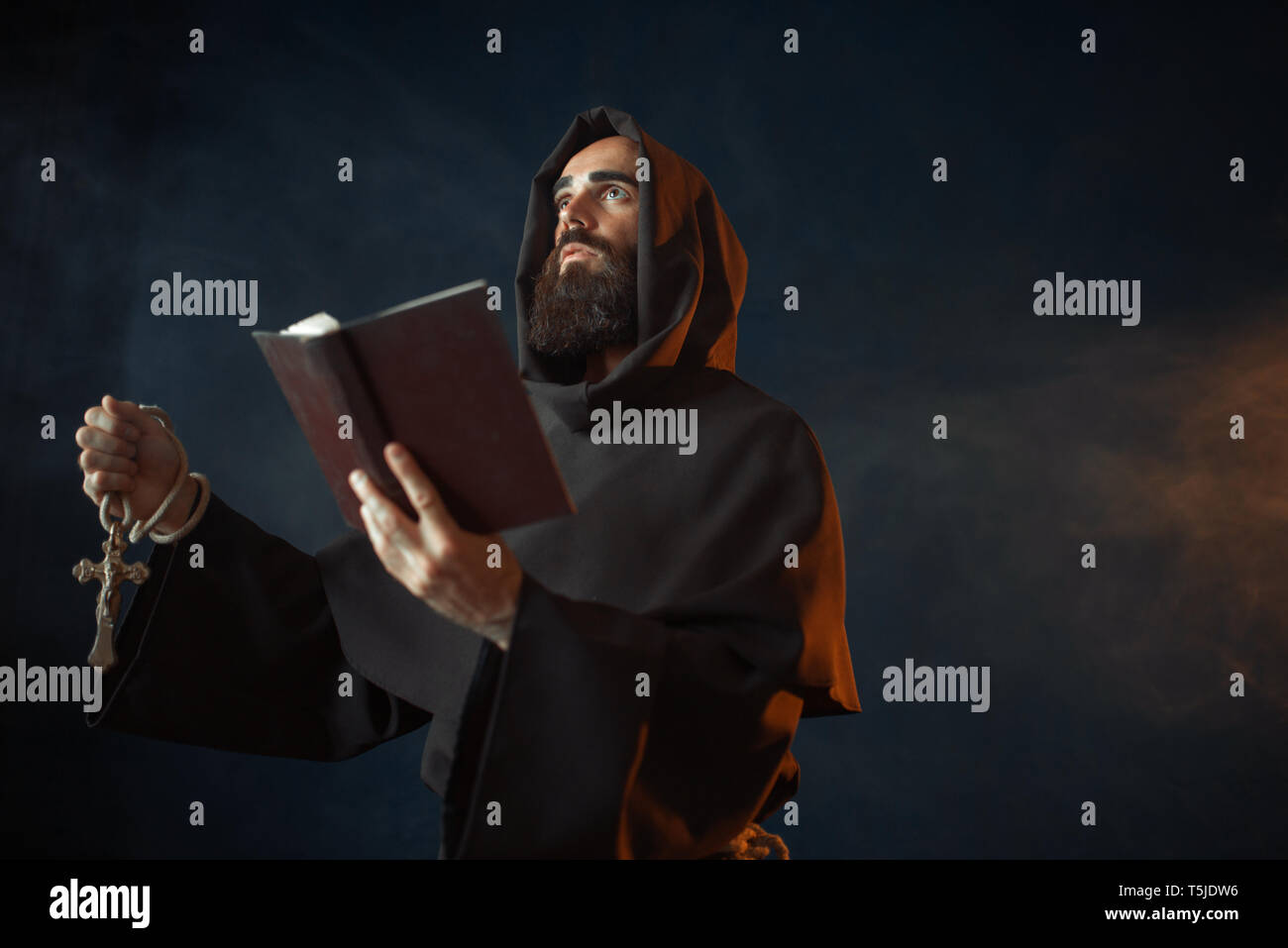 Medieval monk with spellbook calling the spirits, secret ritual ...