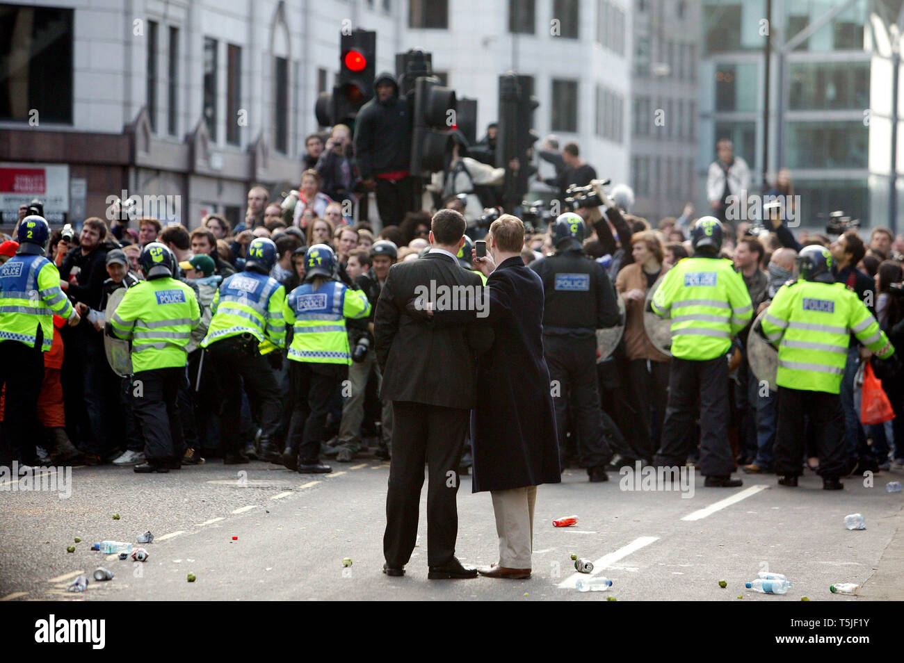 Smart city bankers photograph the protesters near the Bank of England ...