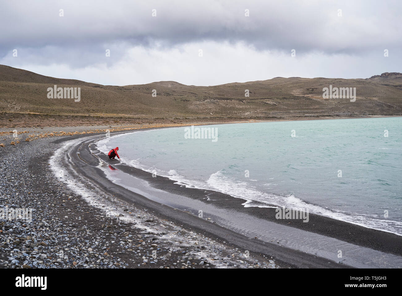 Man touching cold water torres del paine national park hi-res stock ...