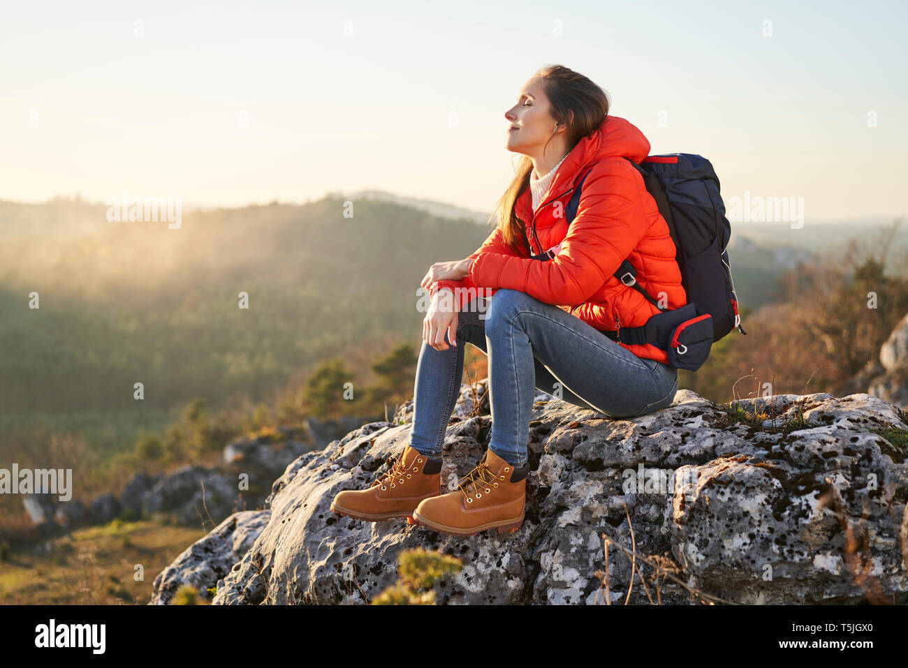 Woman resting on rock hi-res stock photography and images - Alamy