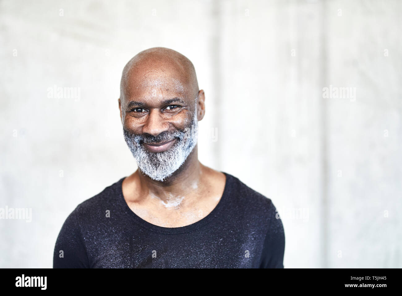 Portrait of sweating bald man with grey beard Stock Photo - Alamy