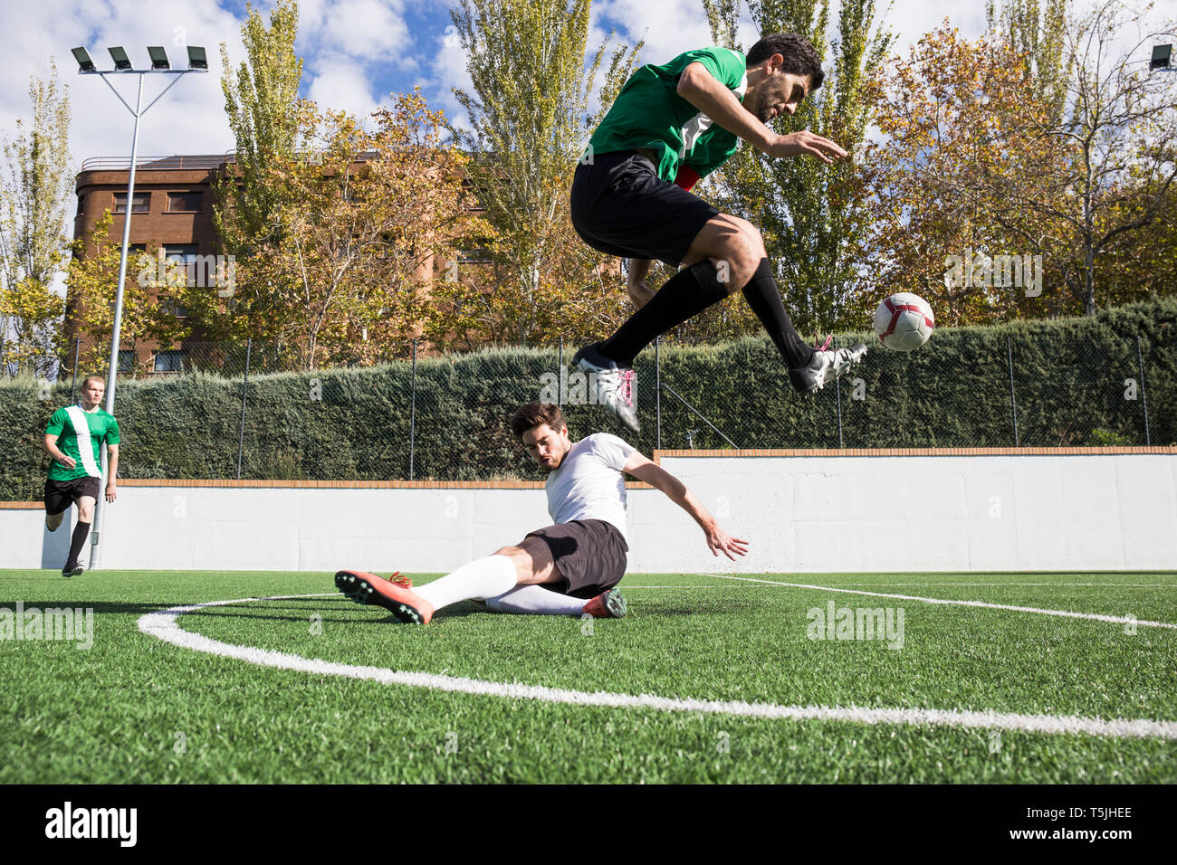Football player kicking ball hi-res stock photography and images - Alamy