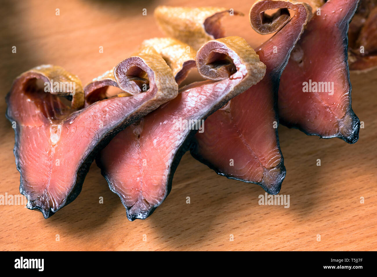 Pieces of dried fish with red meat of pink salmon Stock Photo - Alamy