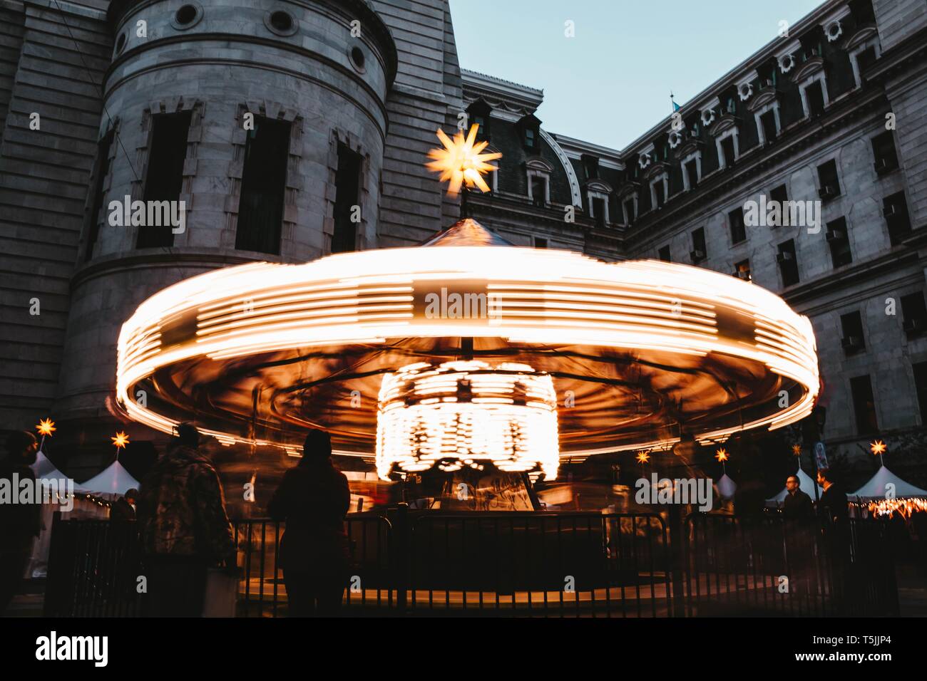 A shining merry go around fast movement at a carnival Stock Photo - Alamy