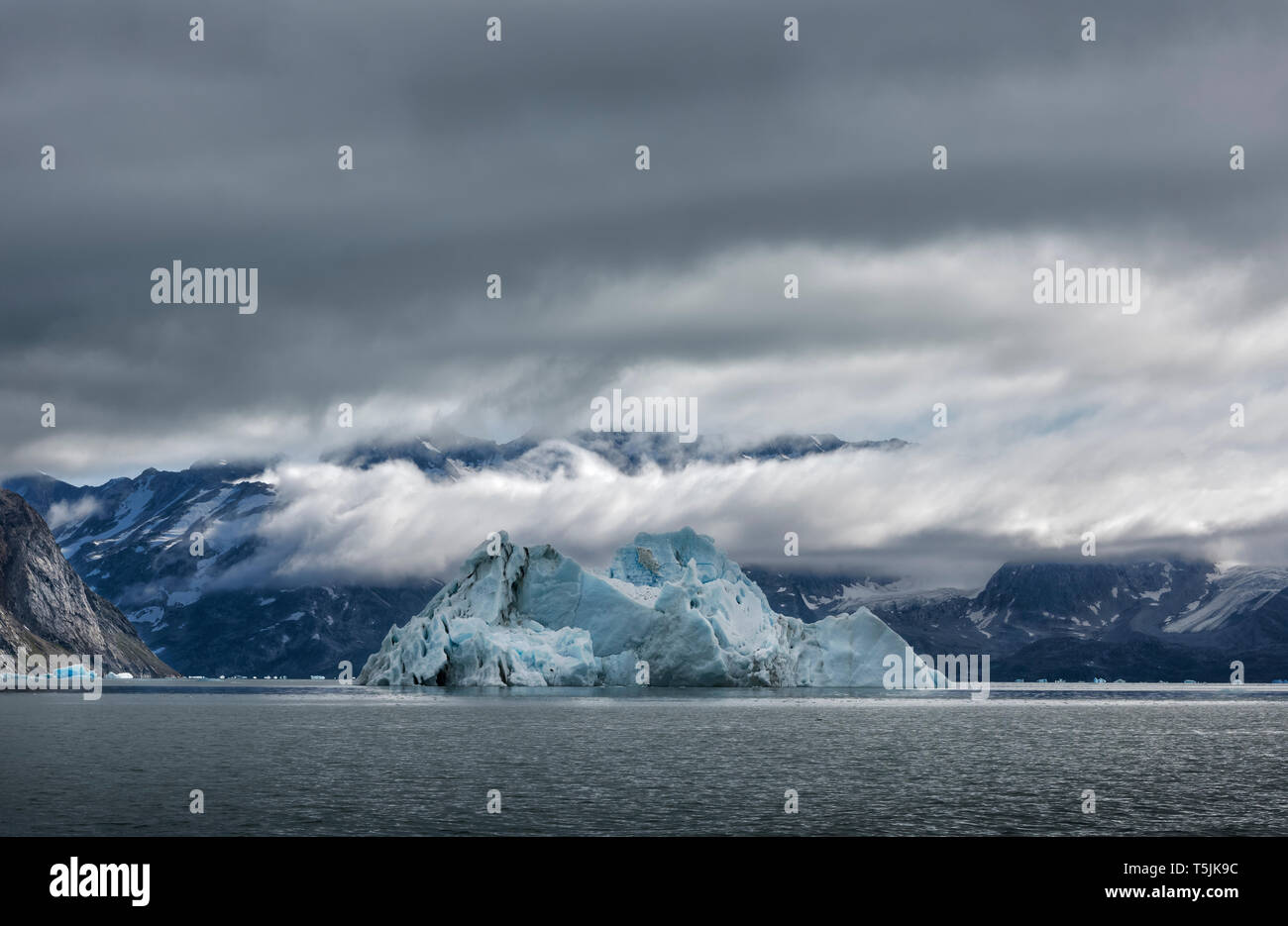 Greenland, Sermersooq, Kulusuk, Schweizerland Alps, iceberg in water ...