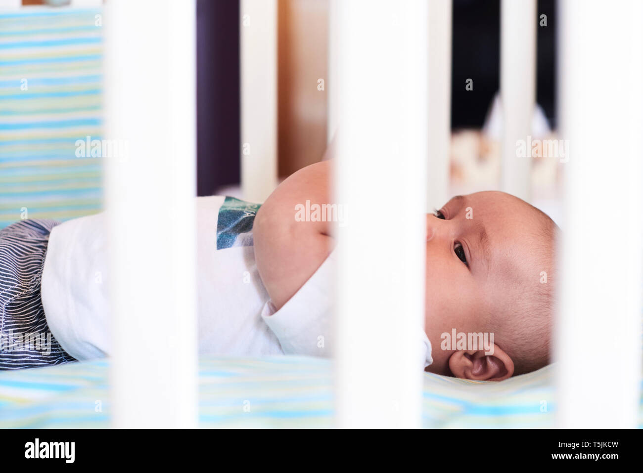 Little boy in the cradle at home Stock Photo - Alamy