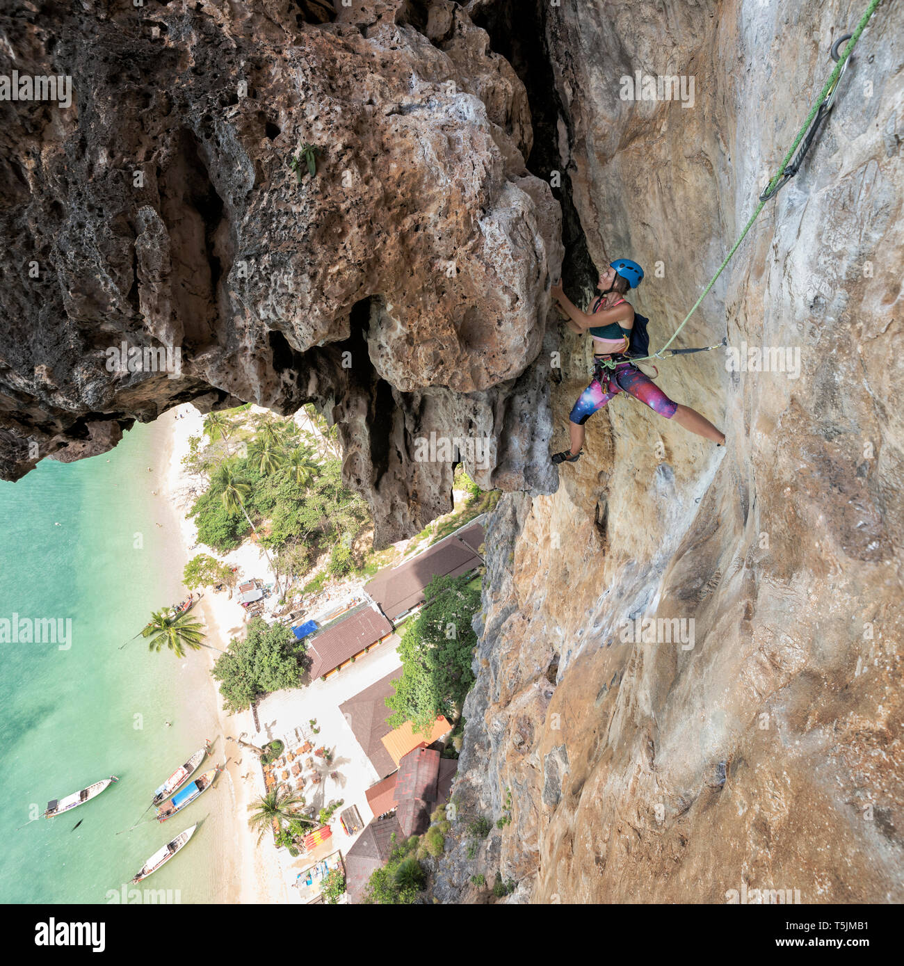 Thailand, Krabi, Tonsai beach, woman climbing in rock wall Stock Photo ...