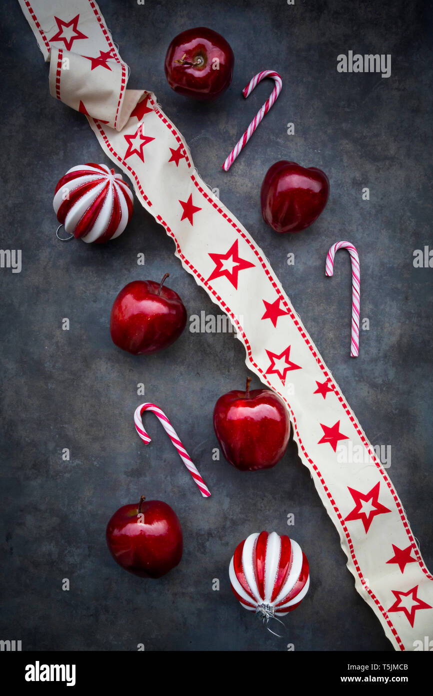 Christmas apples, candy canes and decoration, from above Stock Photo ...